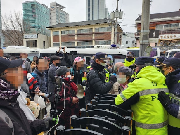 Police track down egg-throwing suspect as protests erupt near ...